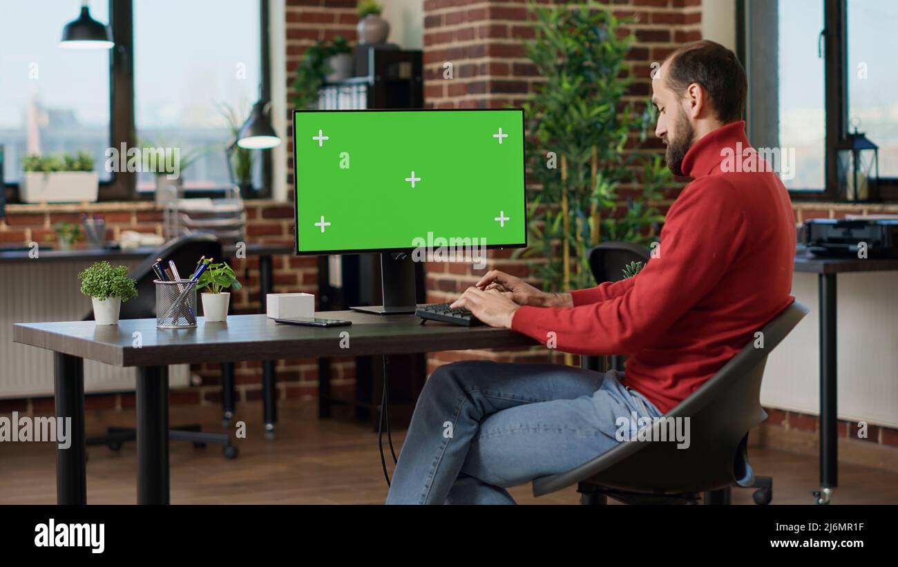 Financial analyst working with green screen on computer, planning ...