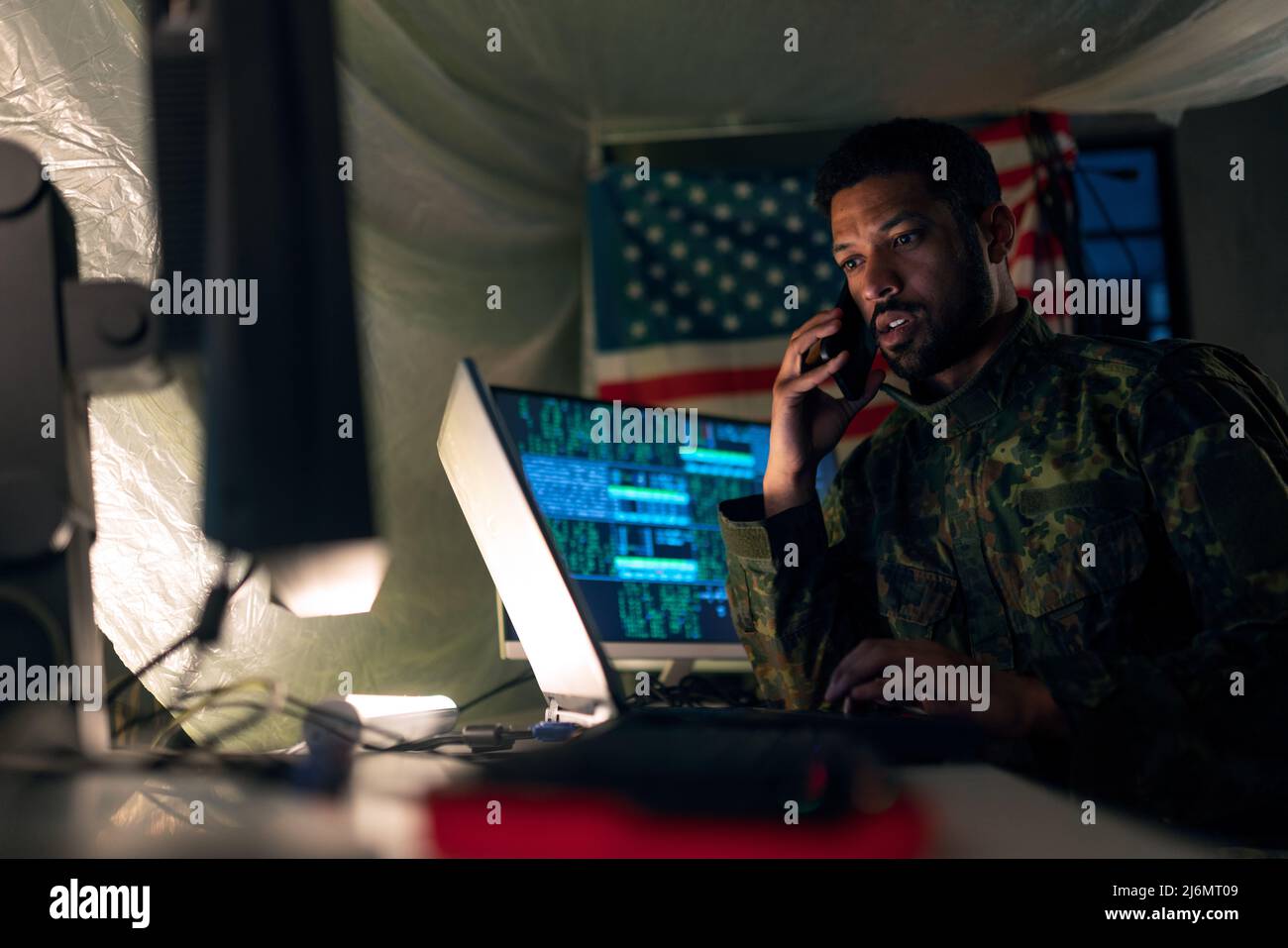 American hacker in military unifrorm on dark web, cyberwar concept ...