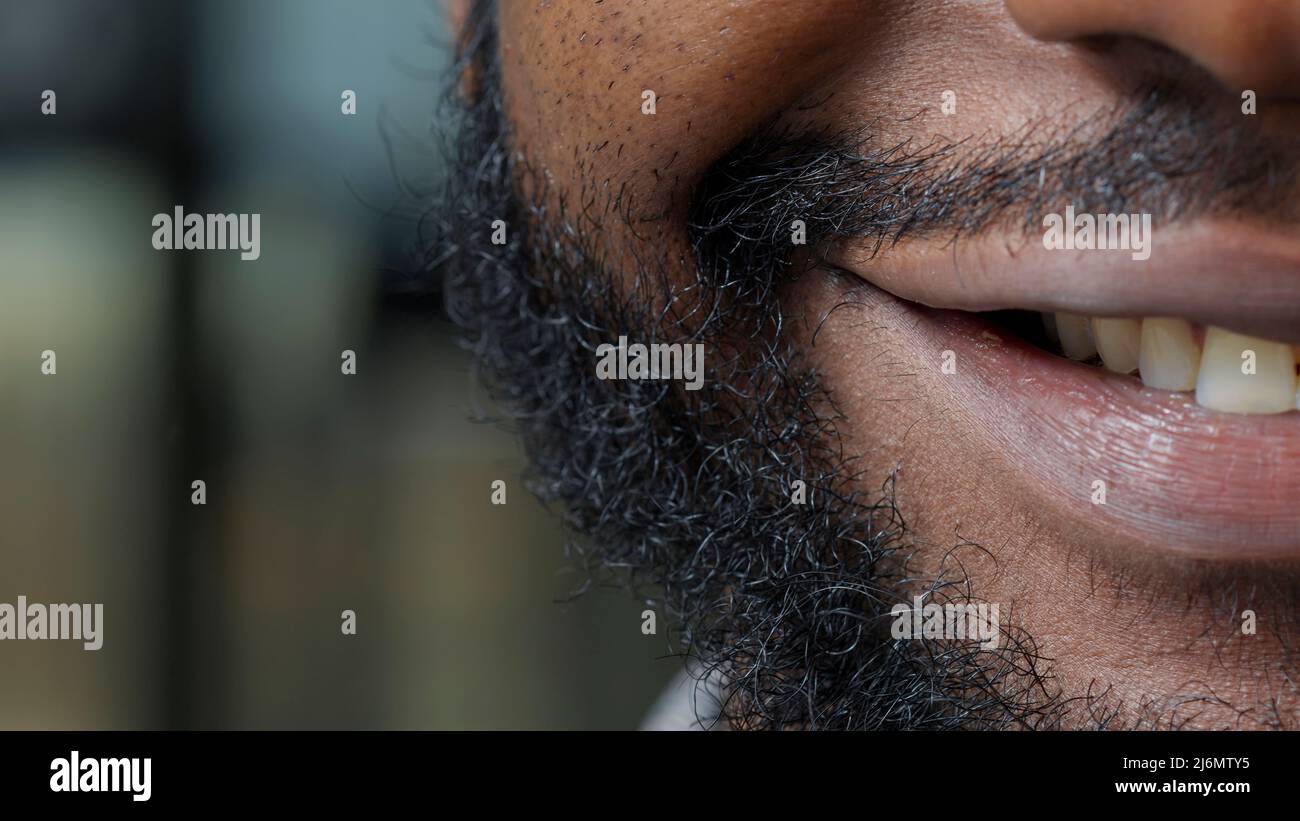 Macro shot of male model moving his lips and showing half of face on ...