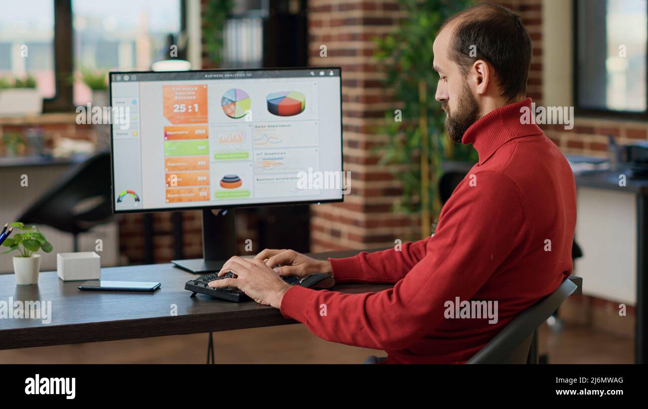 Office worker analyzing executive project to create research statistics ...