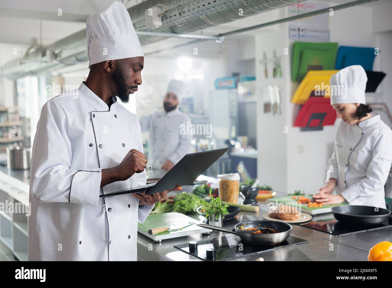 Gastronomy expert wearing professional cooking uniform while searching ...