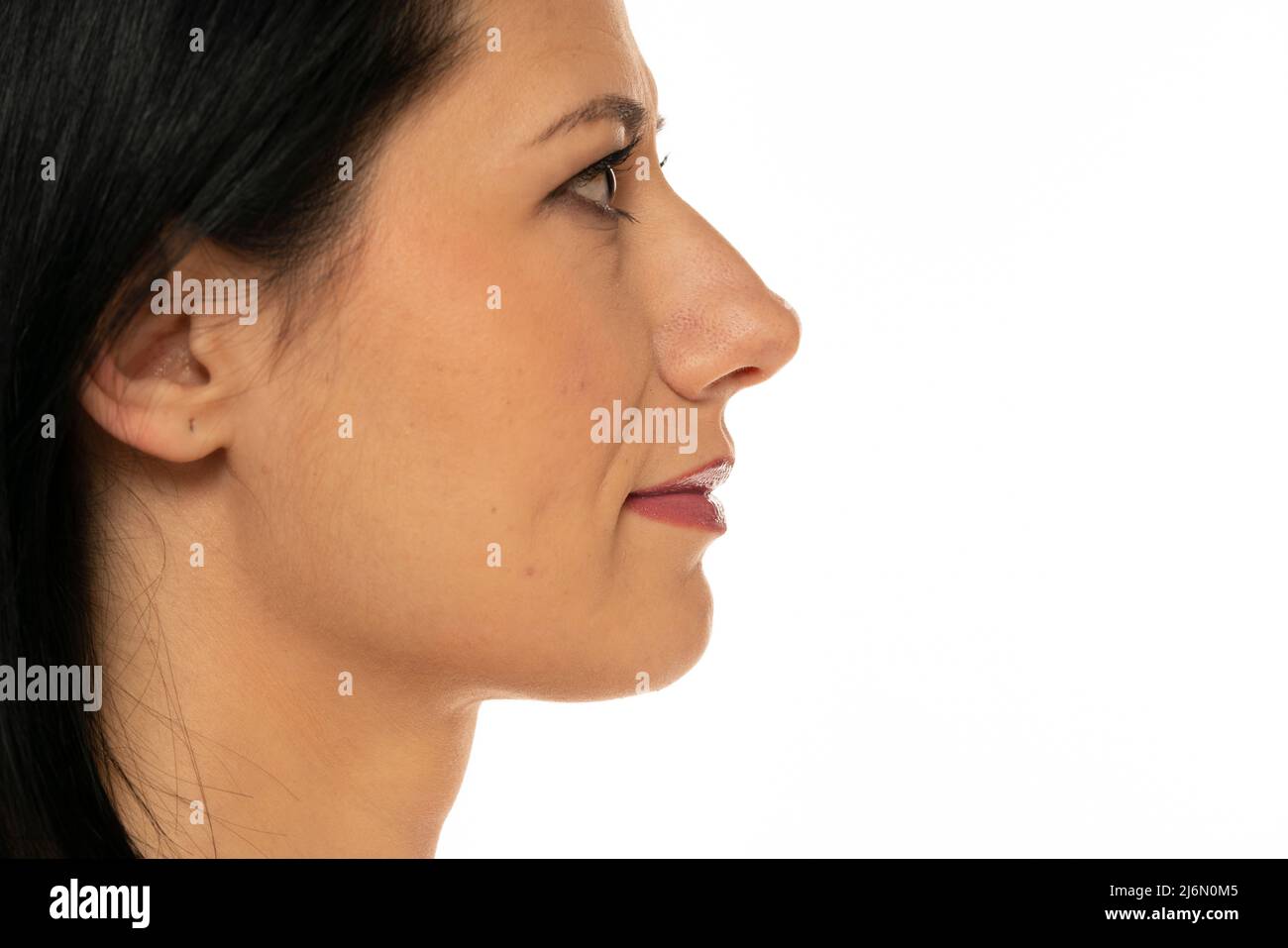 Closeup profile of middle aged woman on a white background Stock Photo ...