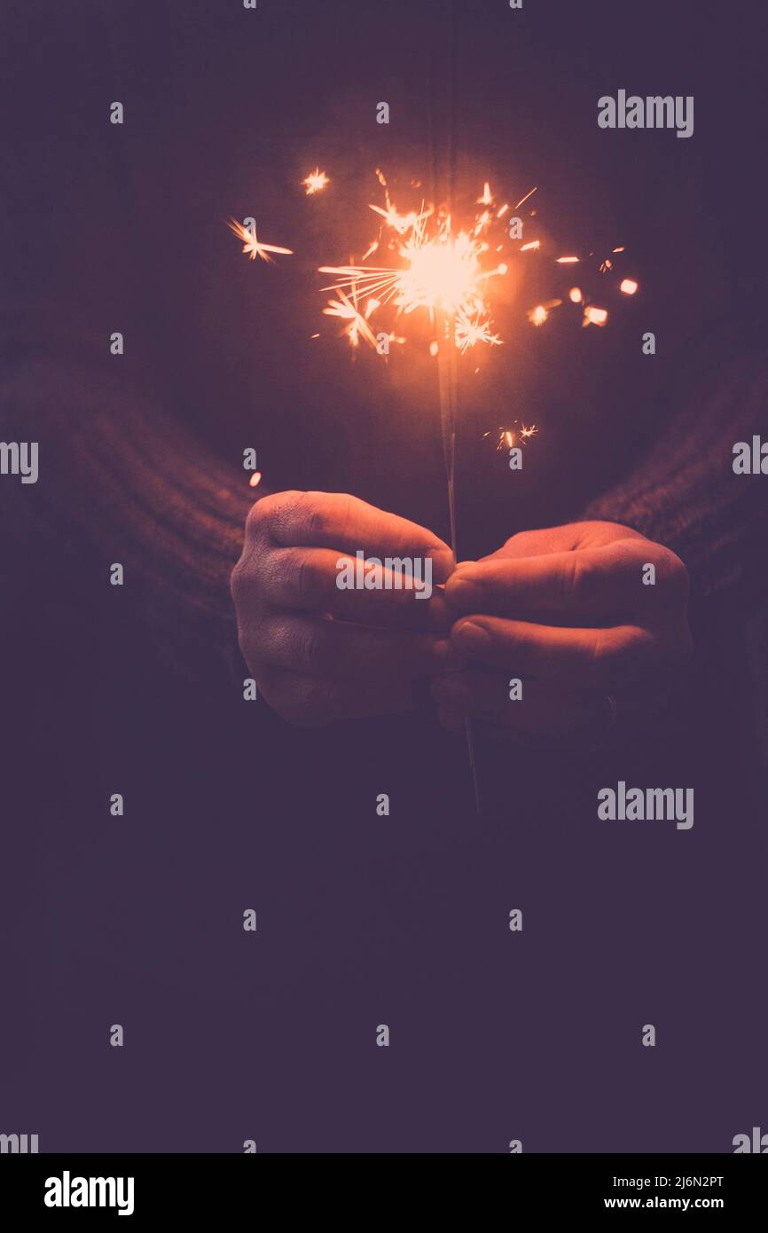 Man holding sparkle hi-res stock photography and images - Alamy