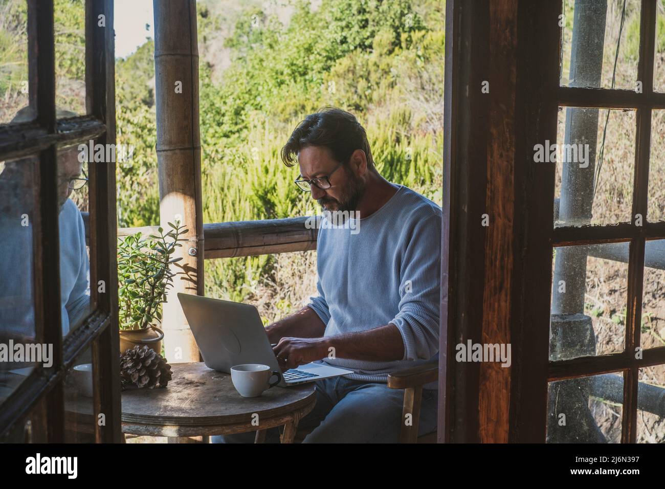 Working at computer rural hi-res stock photography and images - Alamy