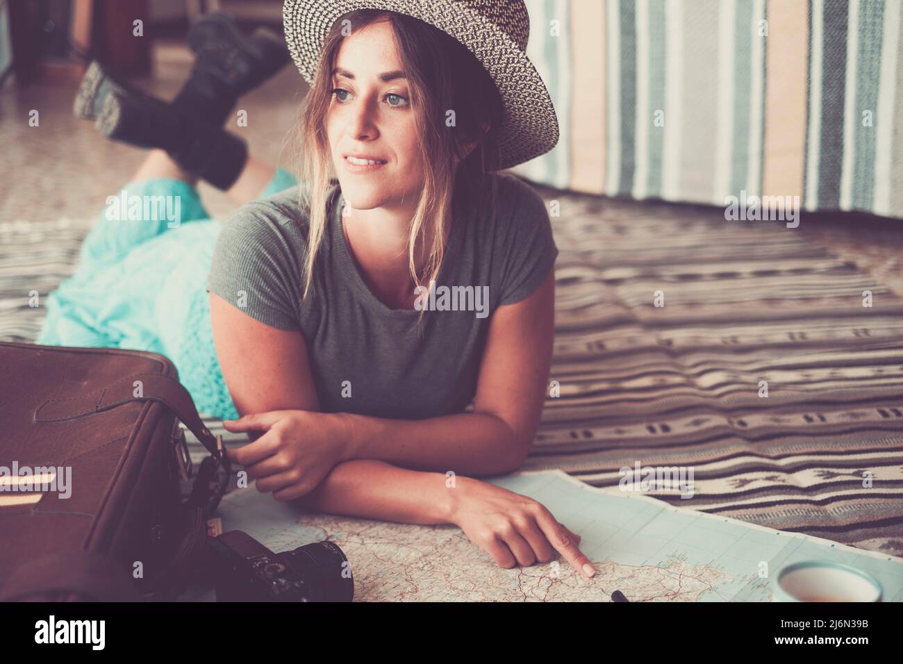 Woman lying with map hi-res stock photography and images - Alamy