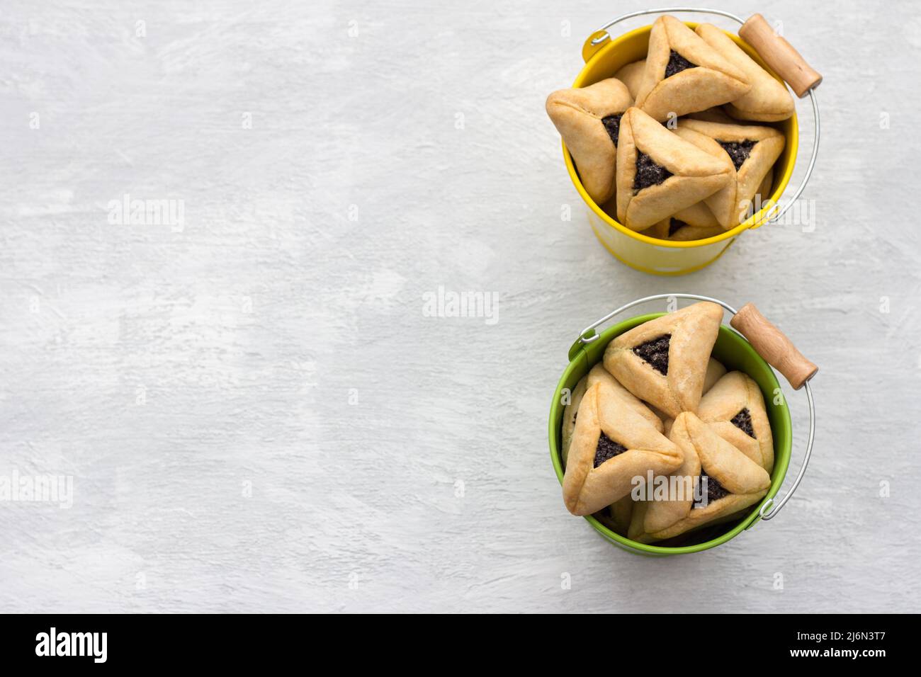 Traditional sweets for Jewish holiday of Purim. Hamantashen cookies or ...