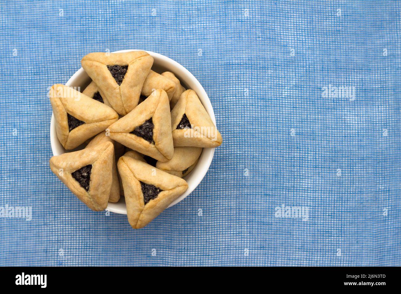 Traditional sweets for Jewish holiday of Purim. Hamantashen cookies or ...