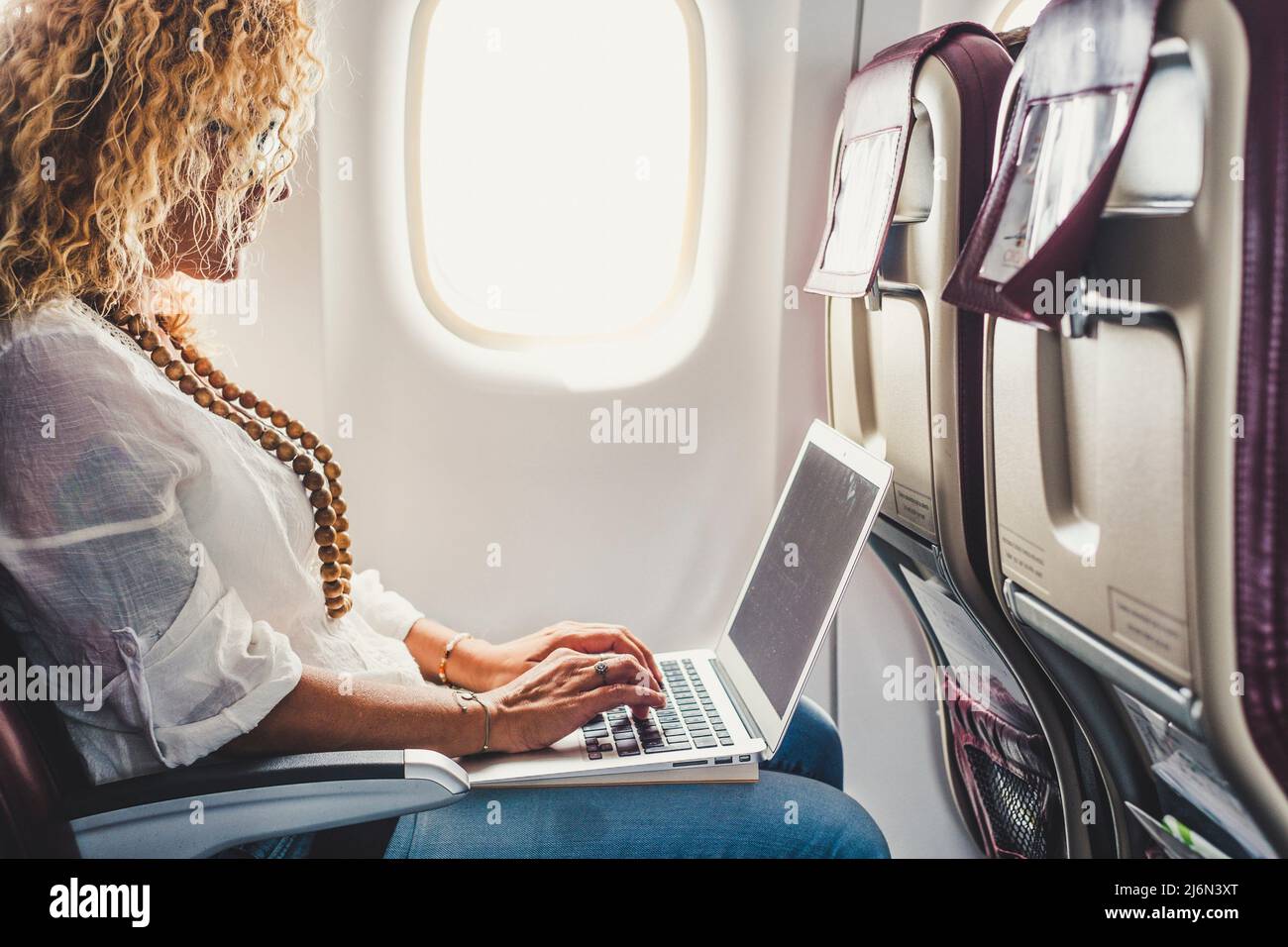 Working on an airplane hi-res stock photography and images - Alamy