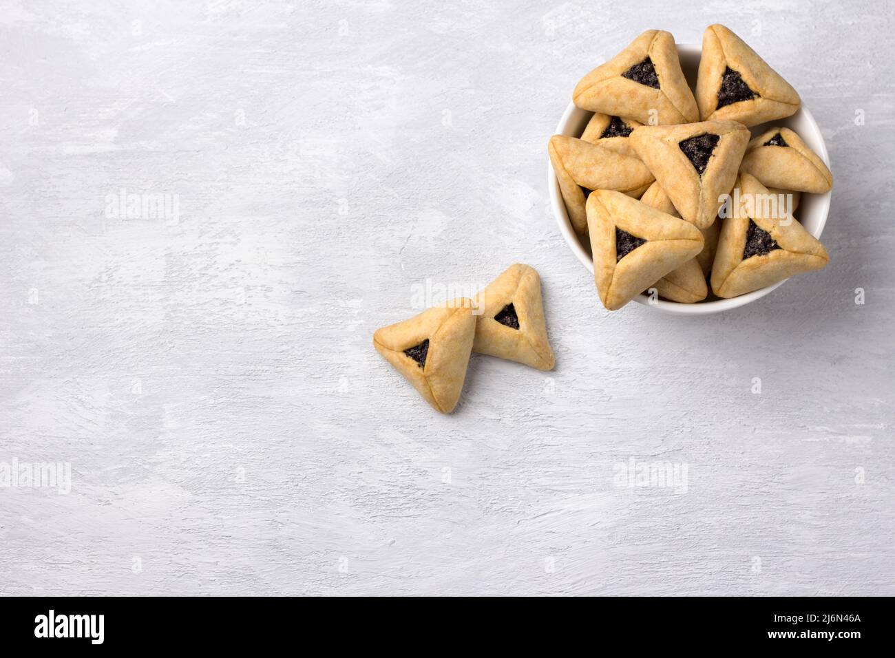 Traditional sweets for Jewish holiday of Purim. Hamantashen cookies or ...