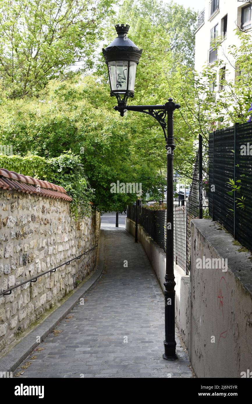 Narrow Passage with street light in La Butte aux Cailles district ...