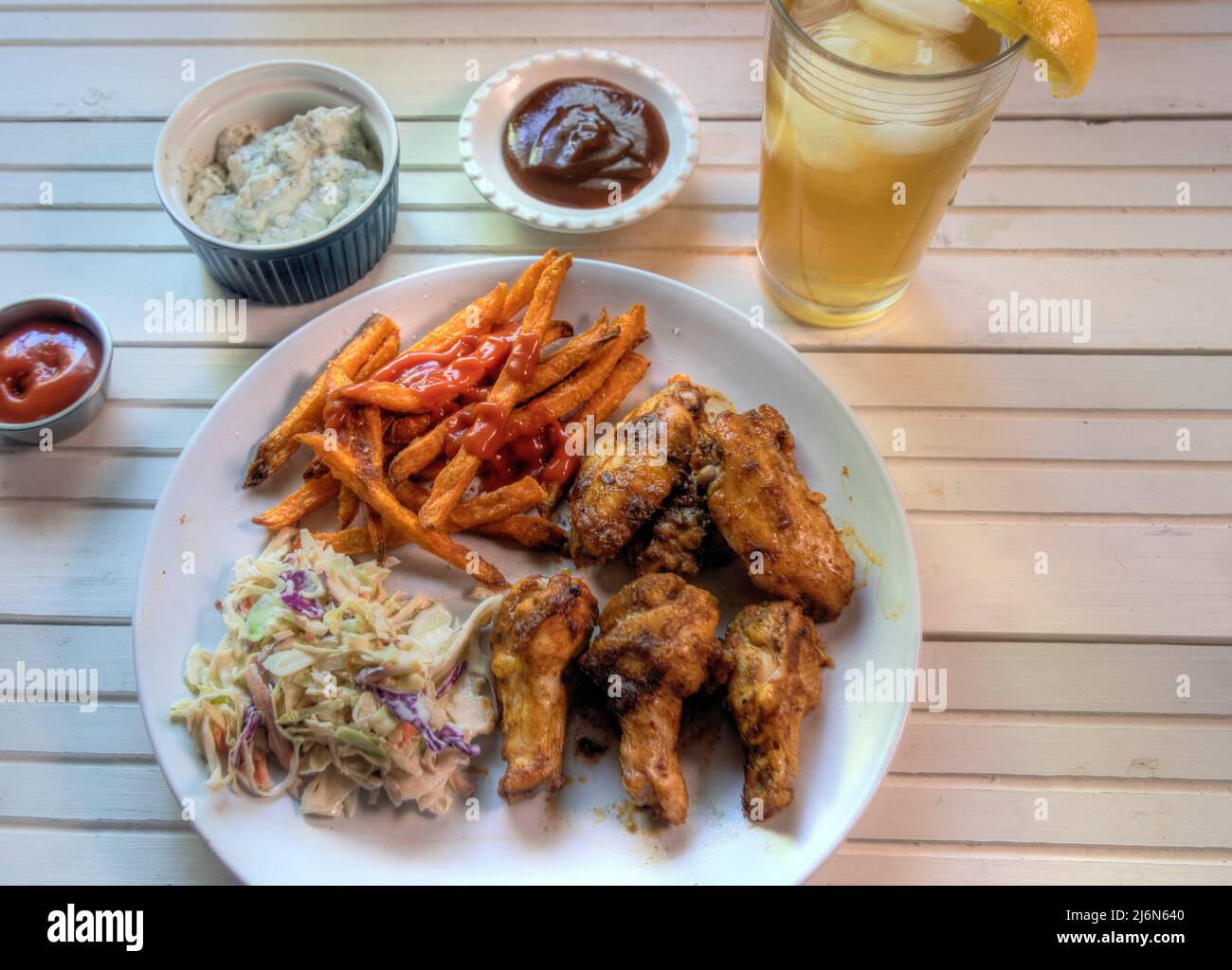 Top view of chicken wings dinner on natural white wood surface Stock ...