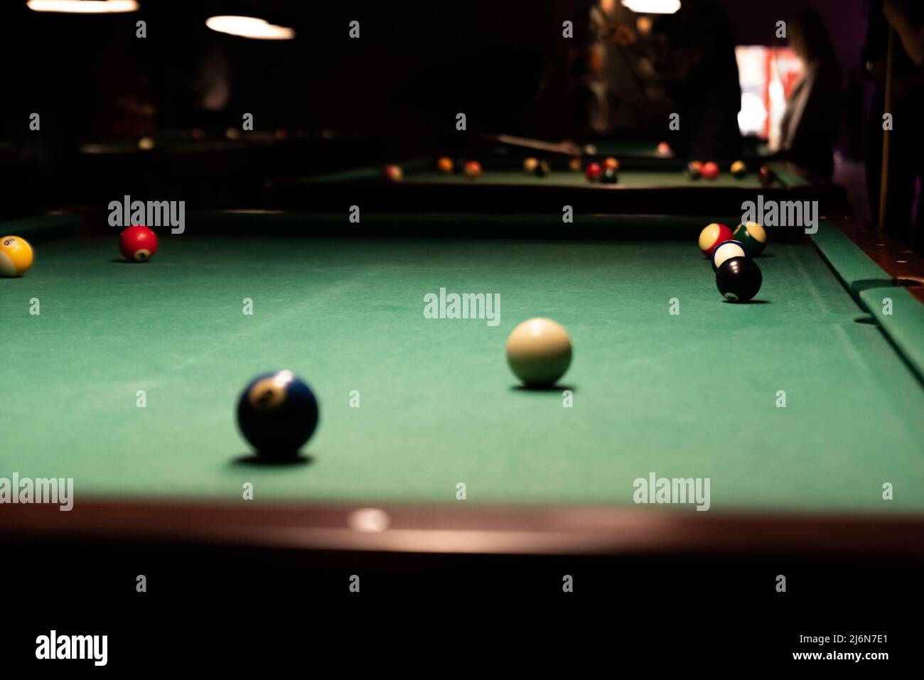 Pool table. Balls on the pool table during the match. Party game with a ...