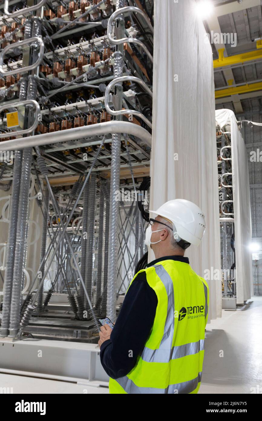 PRODUCTION - 25 April 2022, Spain, Cadiz: A Tennet employee stands in ...