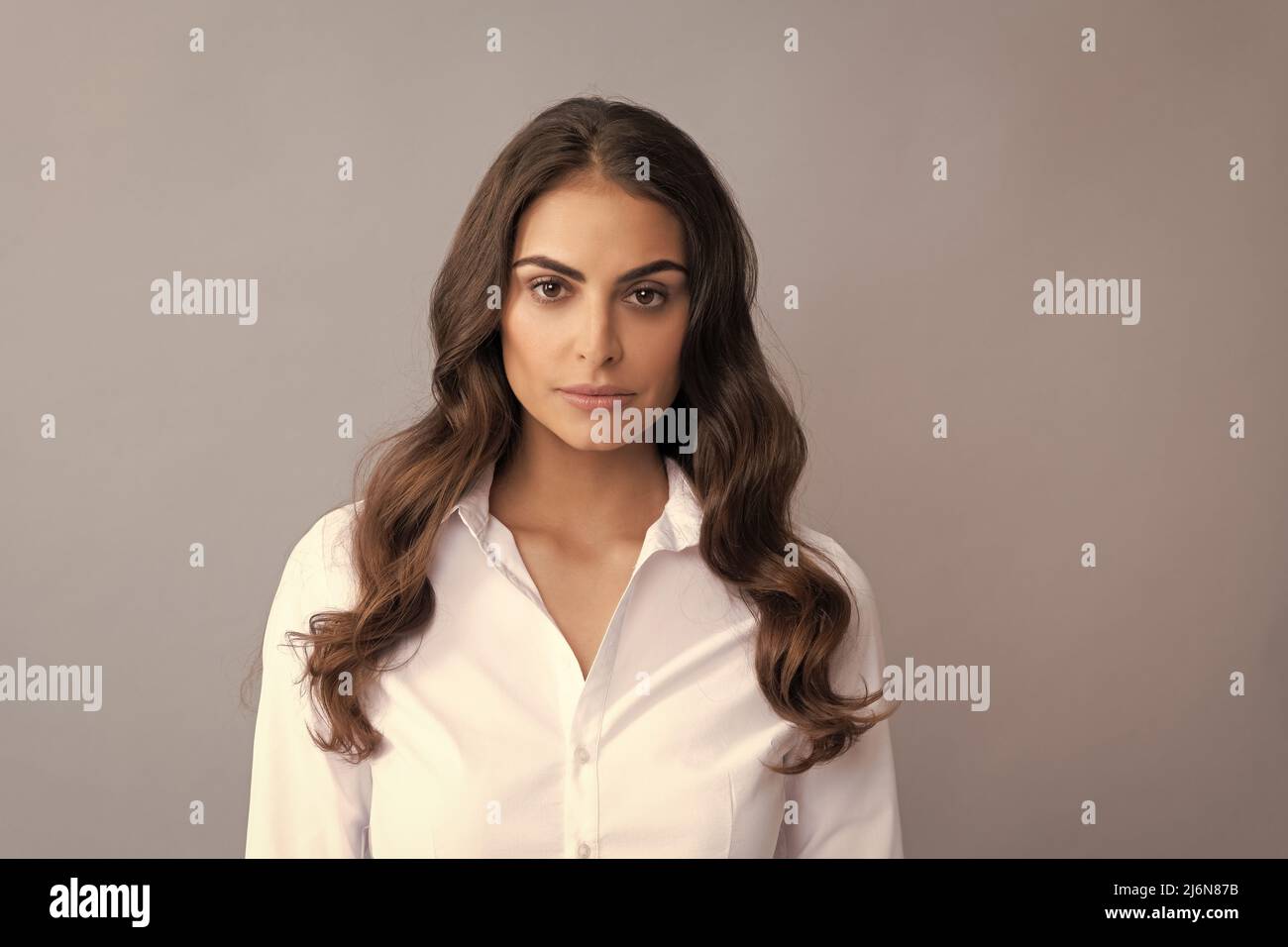 I am a woman. Woman portrait grey background. Career girl face ...