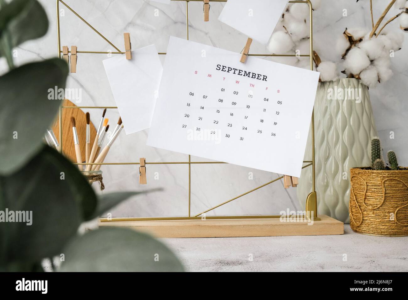 SEPTEMBER CALENDAR Cards and posters mock ups on grid board. Copy space ...