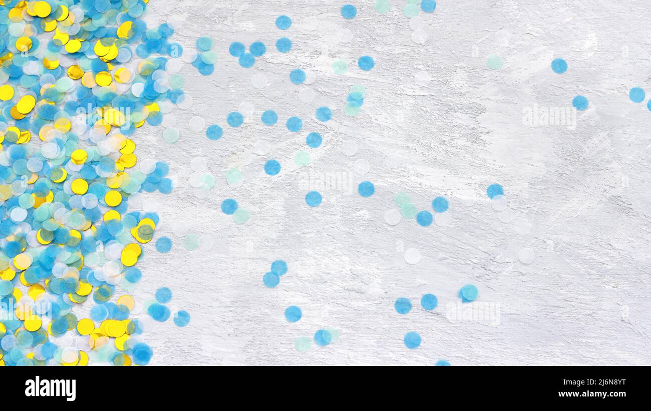 Colorful confetti on light gray background, top view, horizontal Stock ...