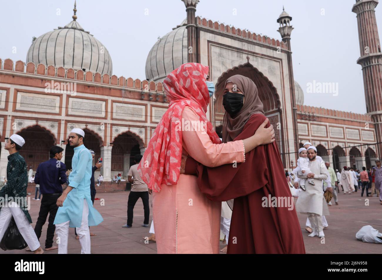 Muslim women greet each other after offering Eid al-Fitr special ...