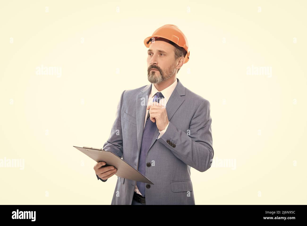 successful man in hardhat making notes. entrepreneur read project. ceo ...