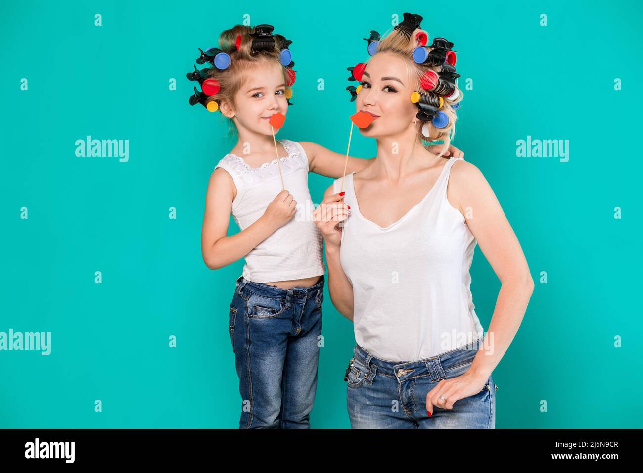 Funny family Mother and her child daughter girl with a paper ...