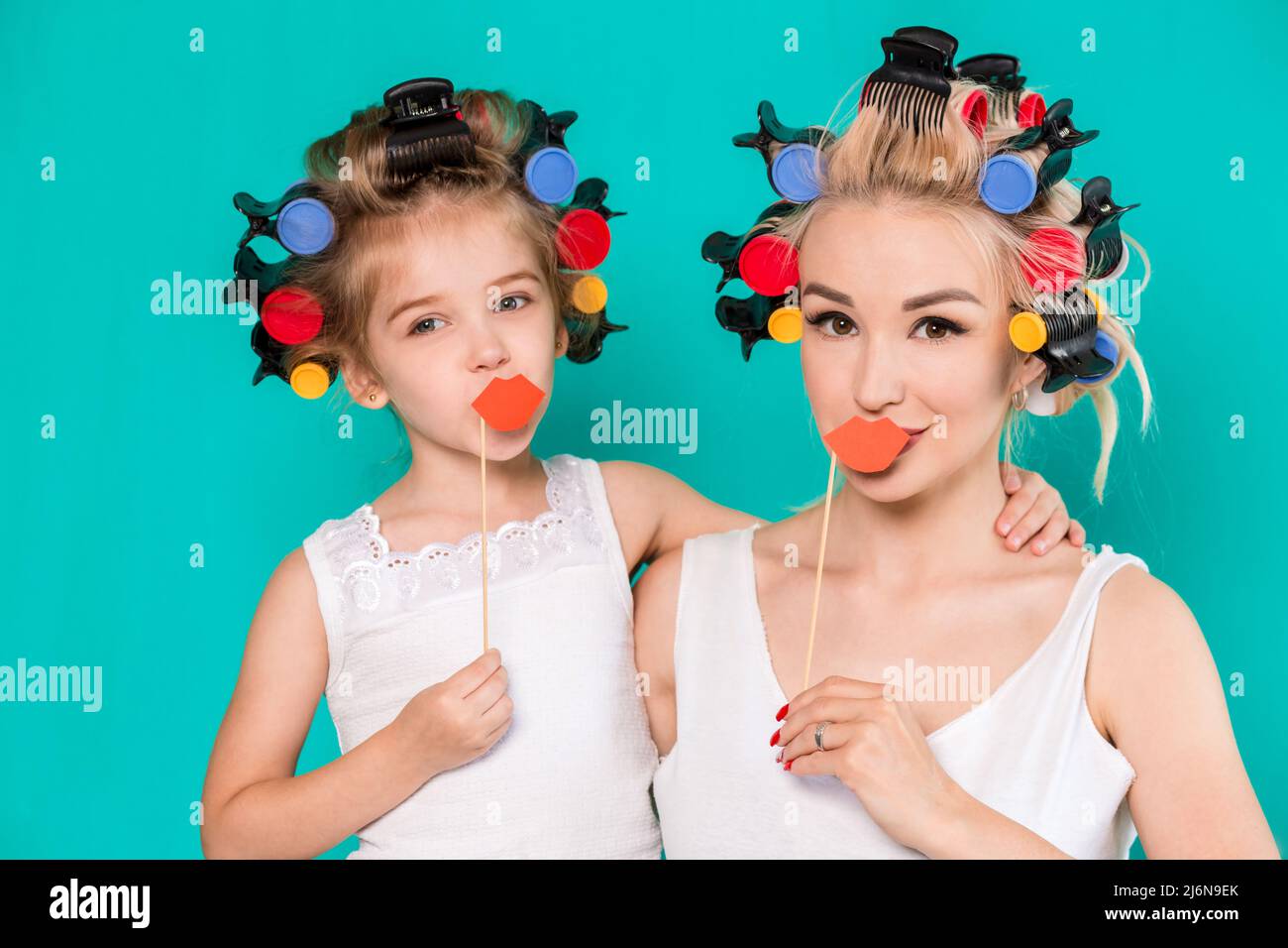 Funny family Mother and her child daughter girl with a paper ...