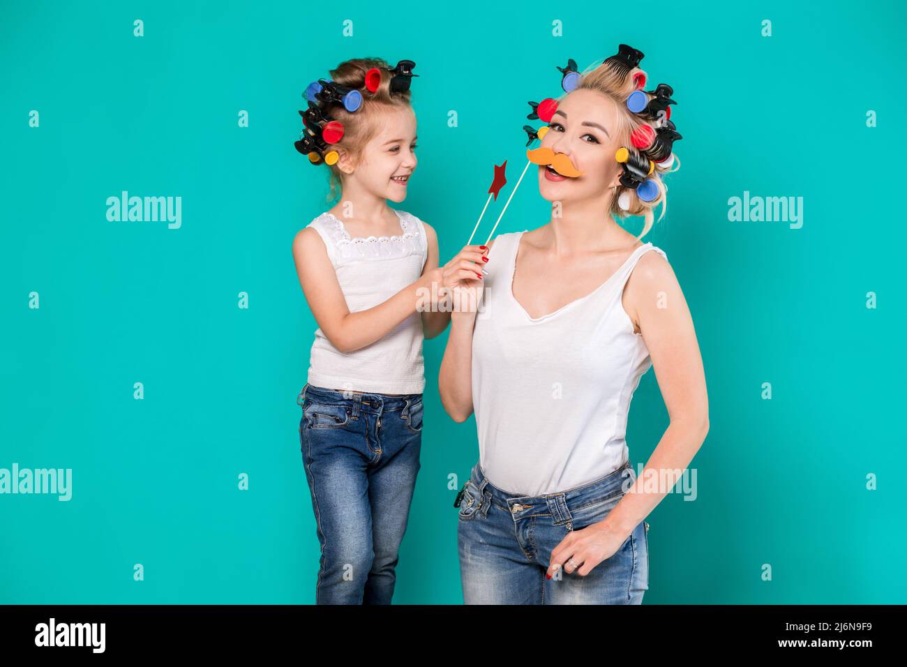 Funny family Mother and her child daughter girl with a paper ...