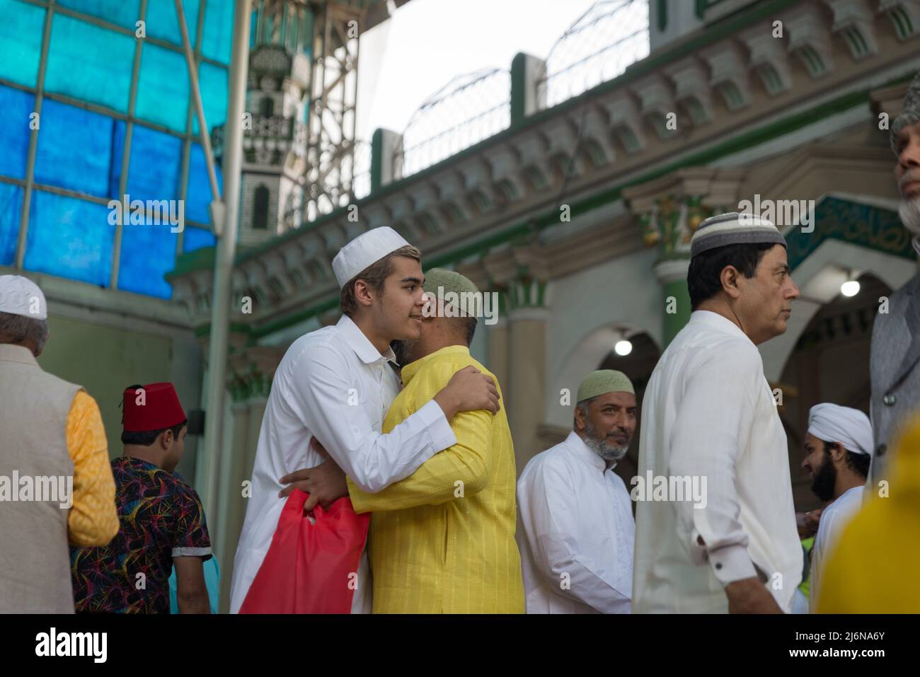 Muslim devotees greet each other after offering special morning prayer ...