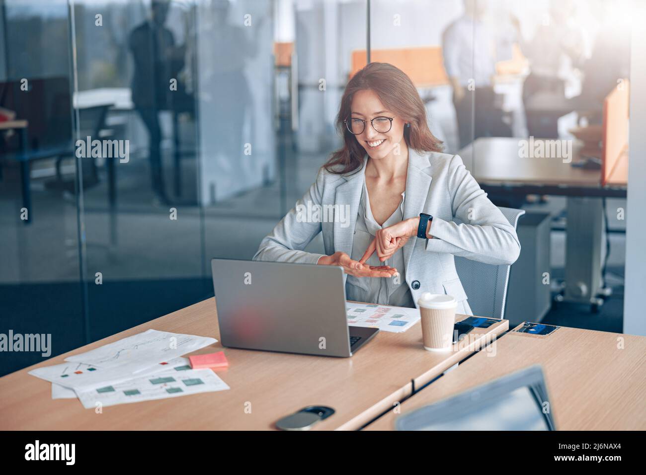 Confident deaf businesswoman communicating in video call at her ...