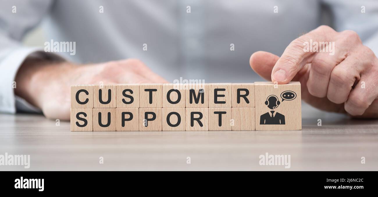 Wooden blocks with symbol of customer support concept Stock Photo - Alamy