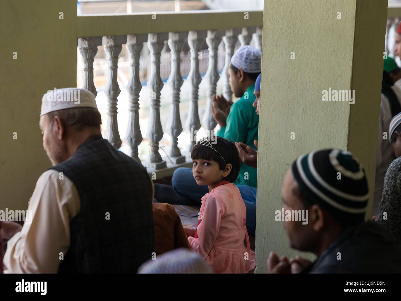 A little girl attends Eid al-Fitr prayers at Kashmiri Masjid in ...