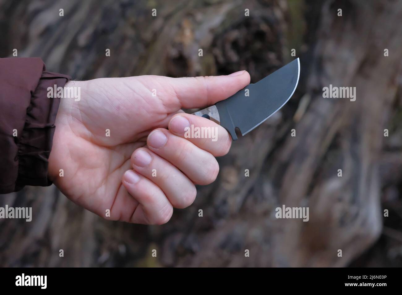 Knife in hand outdoor Stock Photo - Alamy