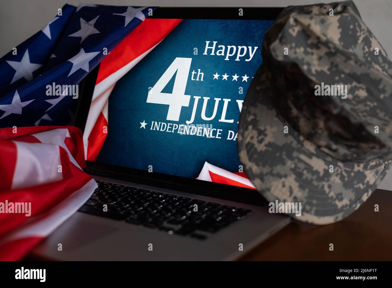 American flags with inscription Happy Independence Day on laptop ...