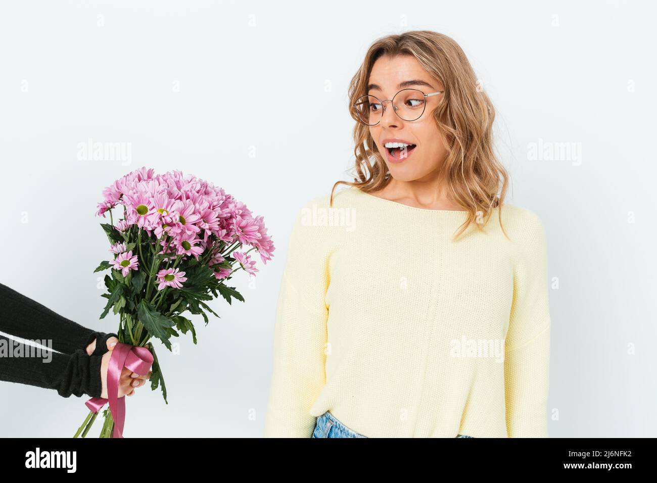 Surprised confused young woman receive bouquet fresh flowers Stock ...