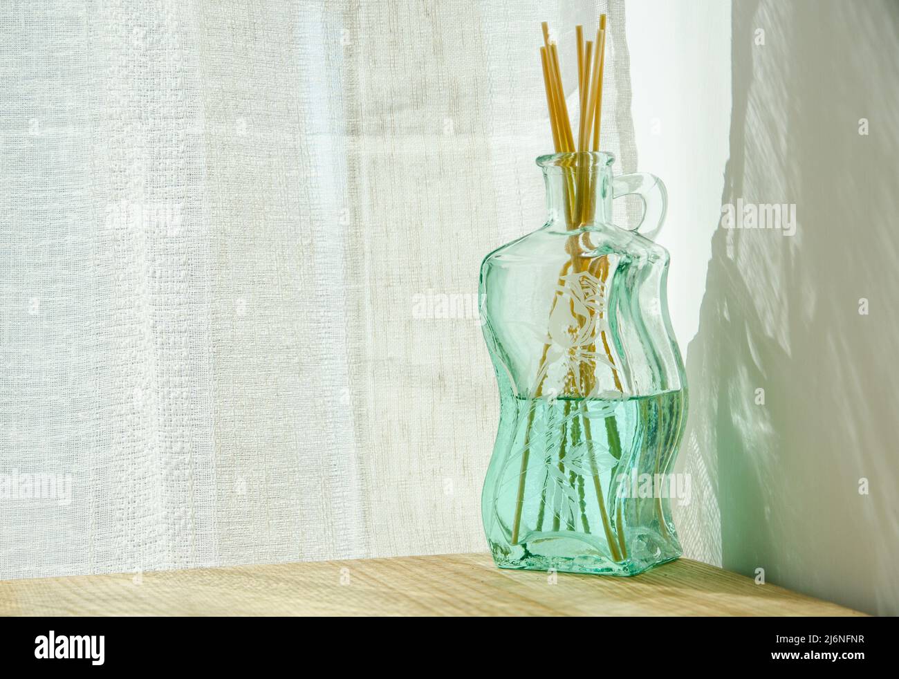 Glass bottle with room fragrance and bamboo diffuser sticks Stock Photo ...