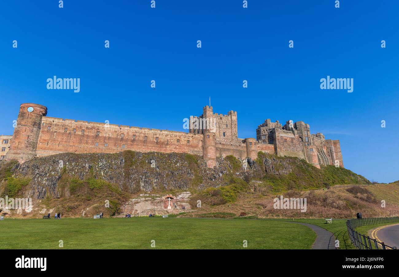 The exterior walls of Bamburgh Castle on a clear day in spring ...