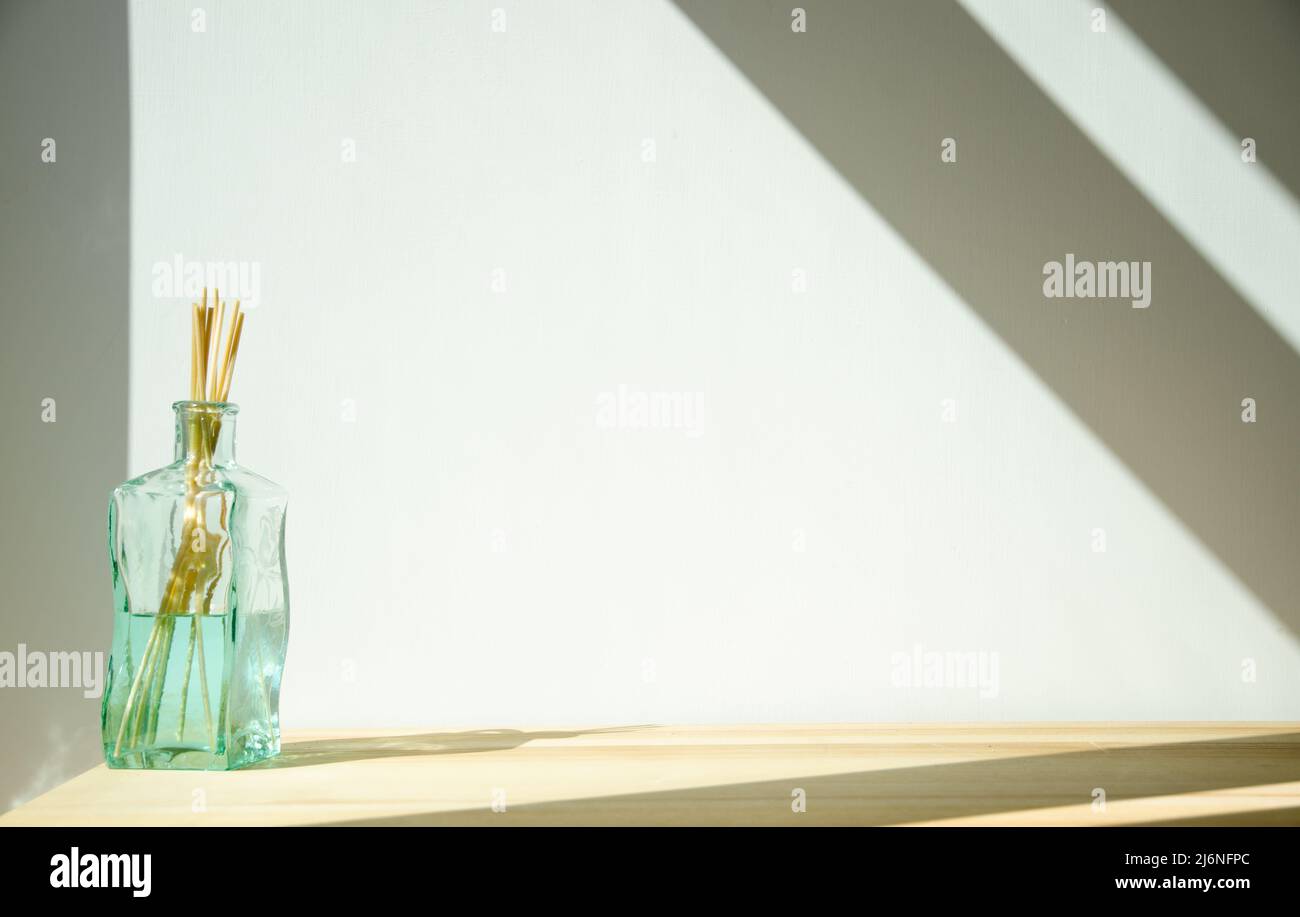 Glass bottle with room fragrance and bamboo diffuser sticks Stock Photo ...