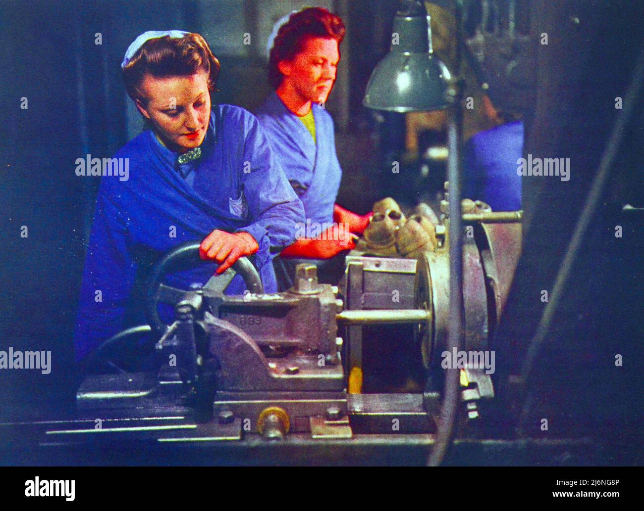 Female workers boring the base of mortar bombs in factory during the ...