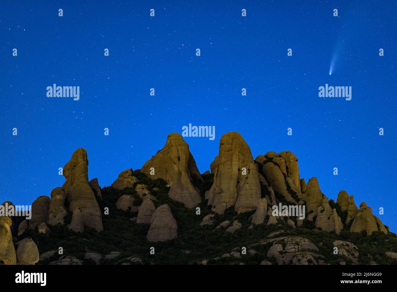 Neowise comet over the peaks of Montserrat (Barcelona province ...