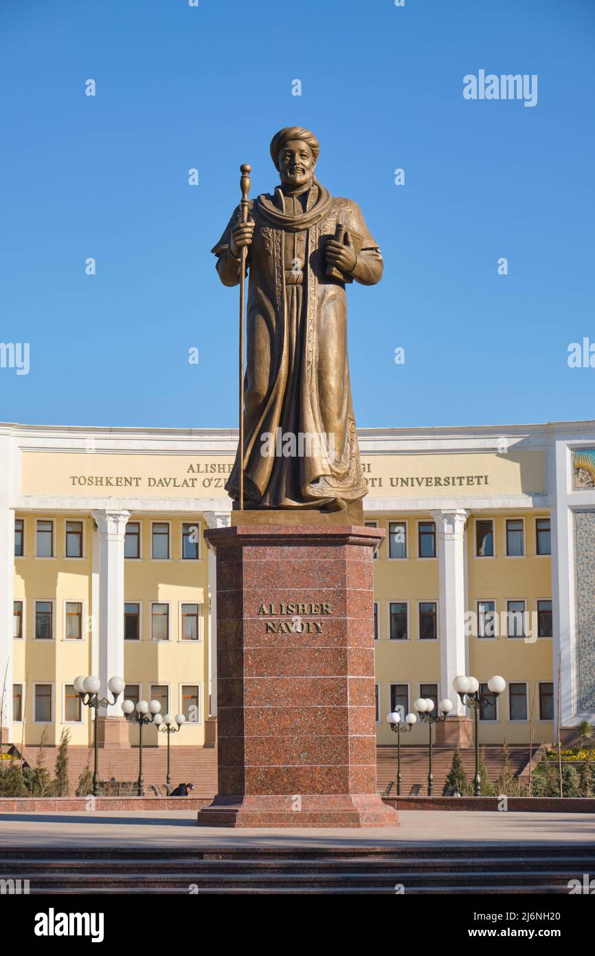 A statue of the poet Alisher Navoi in front of the facade, entrance of ...