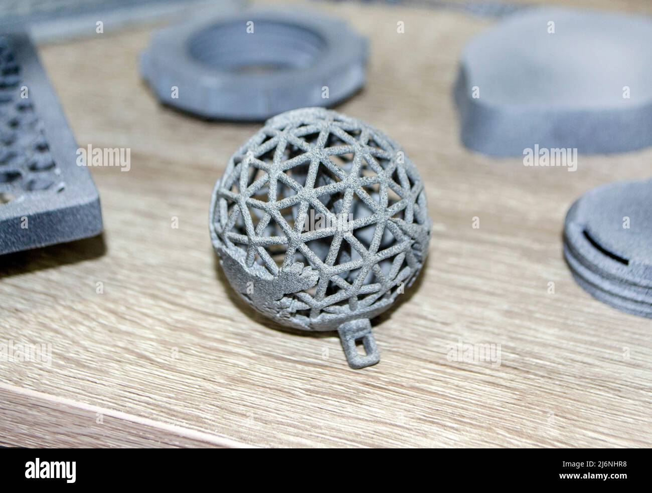 Many models printed on 3D printer. Gray and black objects printed on 3D ...