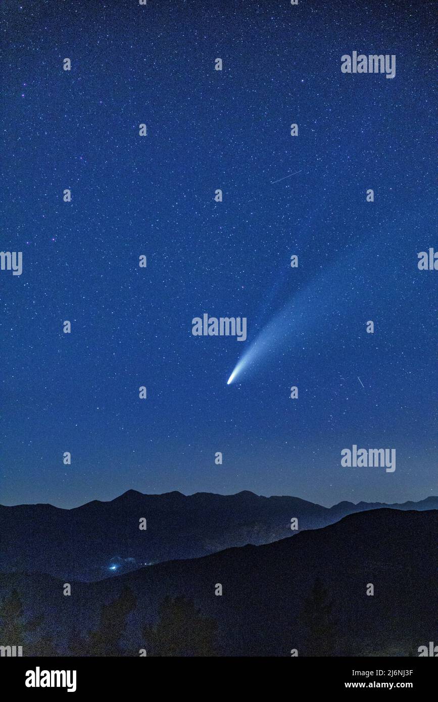 Neowise comet over the peaks of the Alt Urgell region, in the central ...