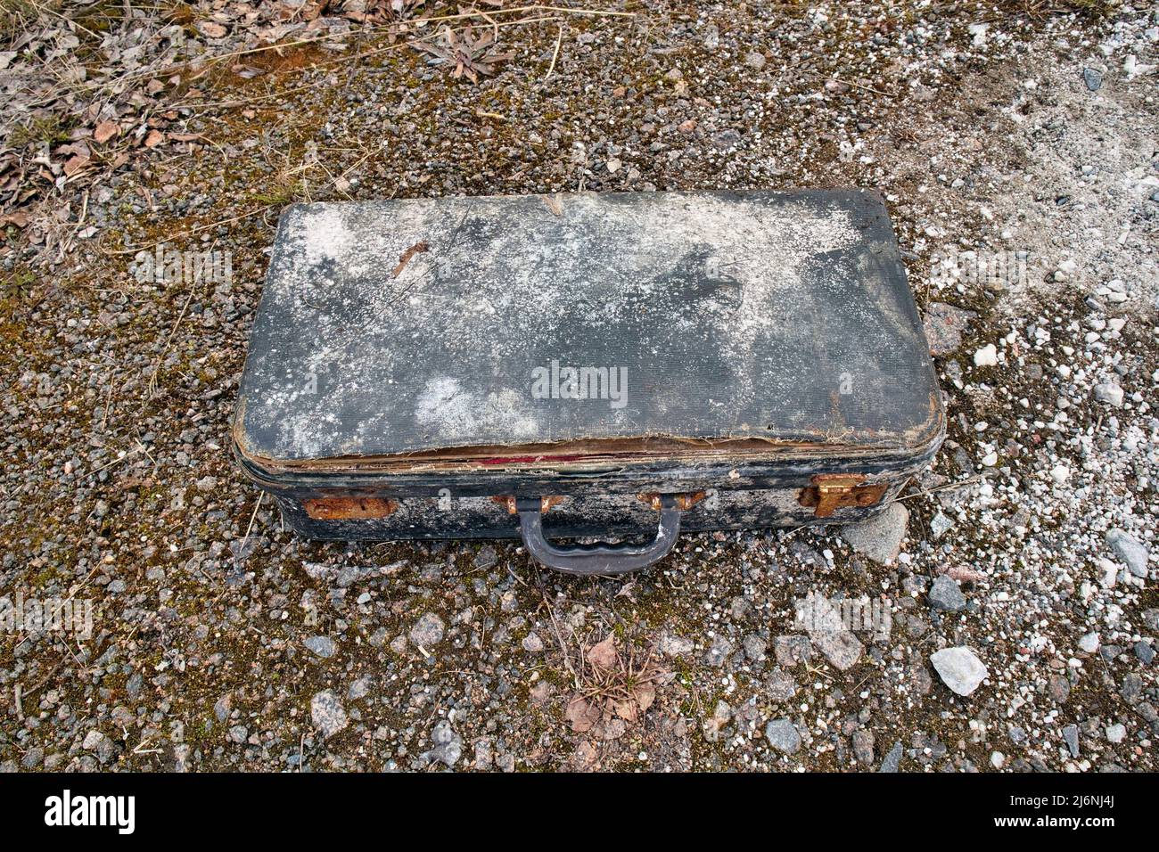 Old abandoned suitcase outdoors Stock Photo - Alamy
