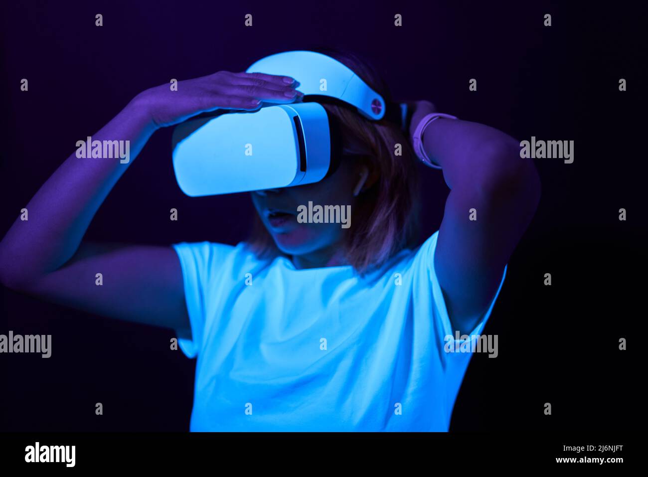 Woman interting with virtual reality using vr headset. Concept of ... Woman interting with virtual reality using vr headset. Concept of ...