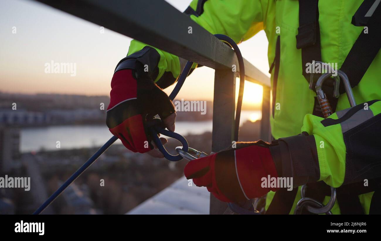 Industrial climber man fastens rope hi-res stock photography and images ...