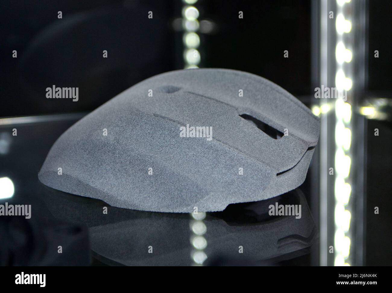 Gray computer mouse printed on 3D printer. Model printed on 3D printer ...