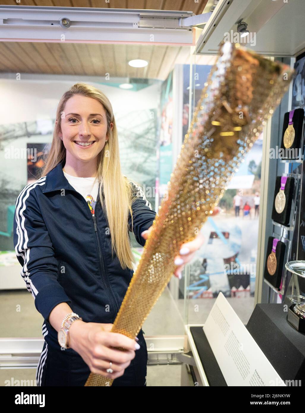 Six-time Olympic medal-winning cyclist Laura Kenny places an Olympic ...