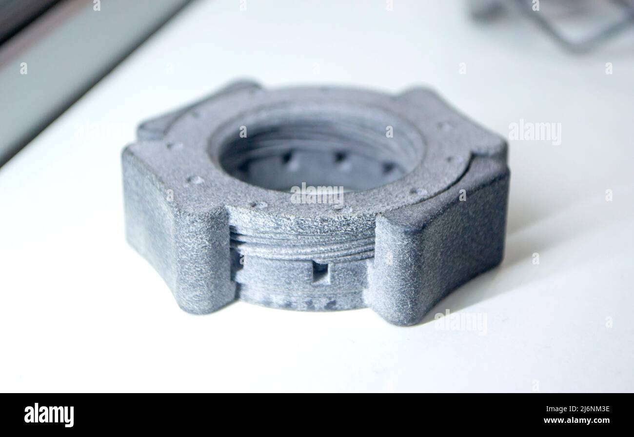 One gray model camera shutter printed on 3D printer. Object printed 3D ...