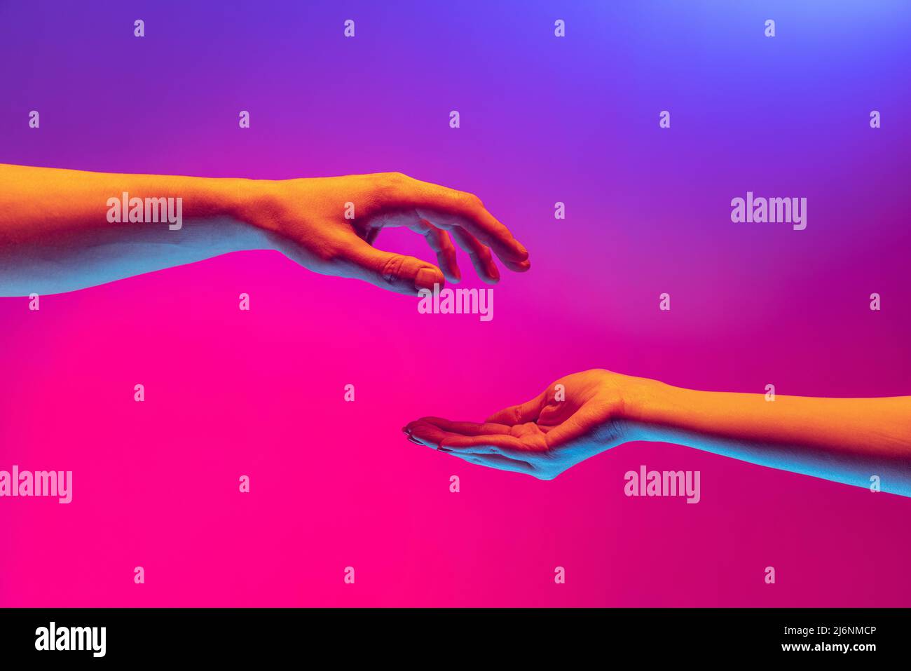 Two authentic hands trying to touch each other isolated on gradient ...