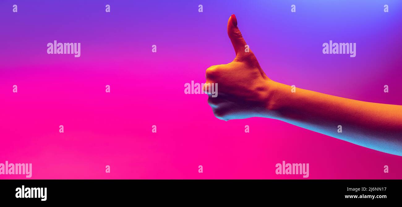 Human hand gesturing isolated on gradient purple-pink background in ...
