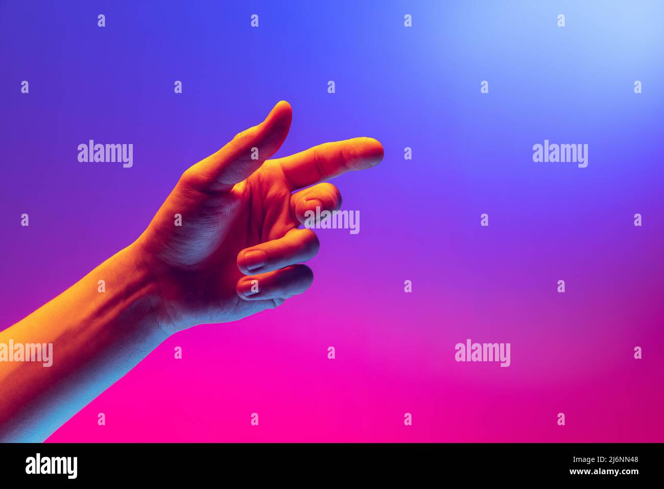 Human hand gesturing isolated on gradient purple-pink background in ...
