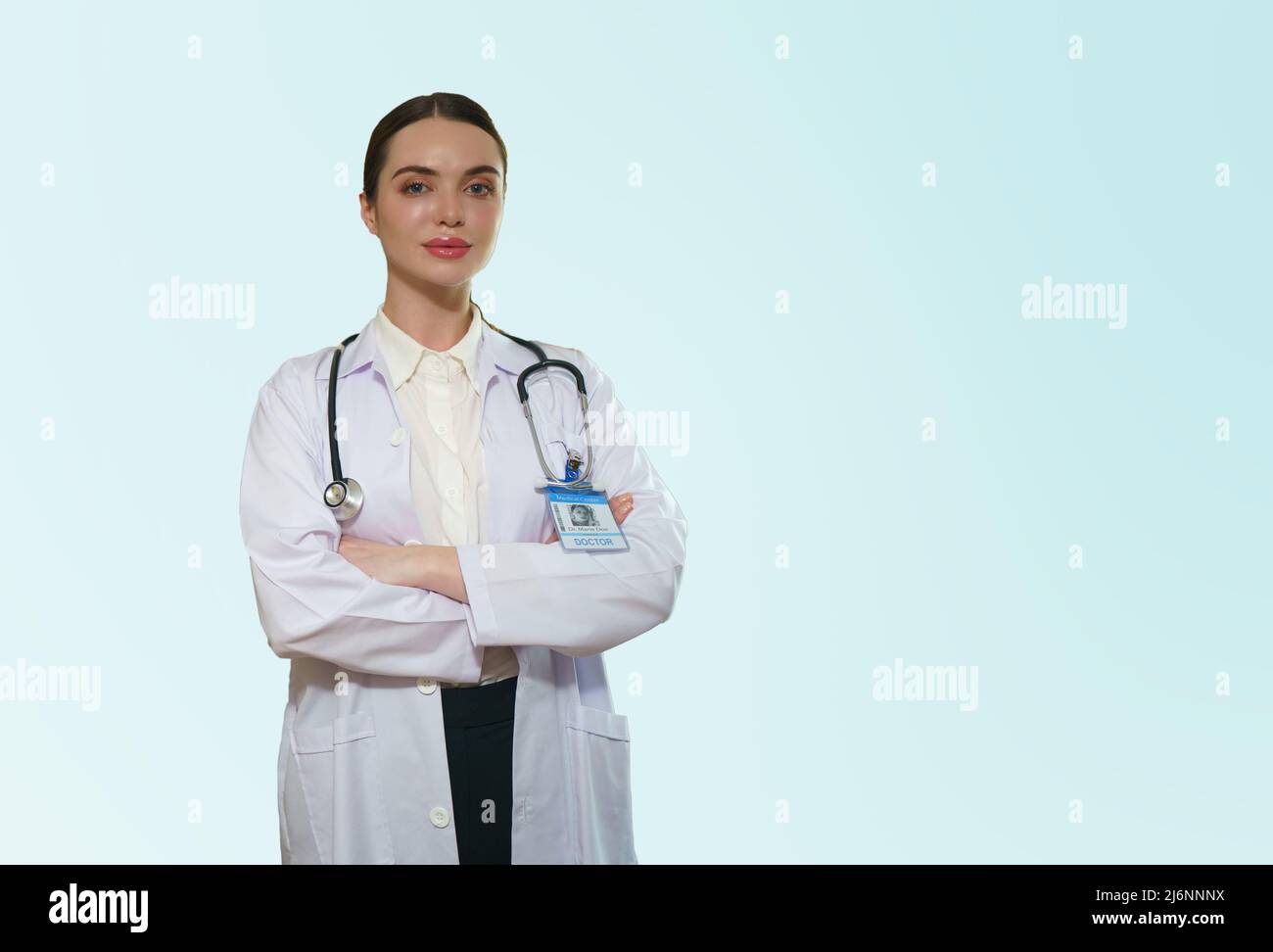 Confidence female doctor arms folded on white background Stock Photo ...